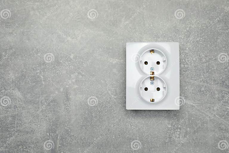 Modern Plastic Power Socket on Grey Table, Top View. Space for Text ...