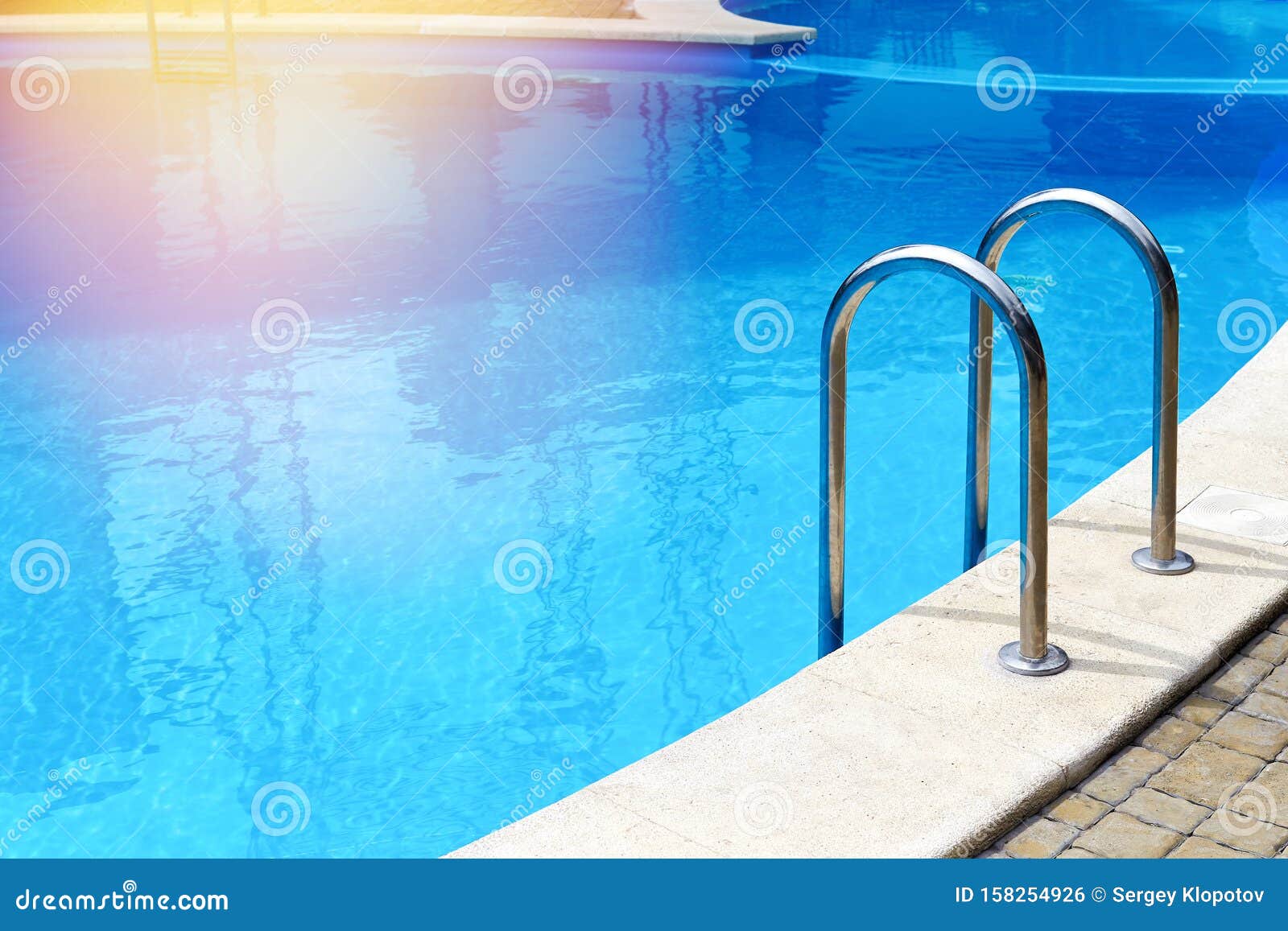 Modern pool with handrails stock photo. Image of clear - 158254926