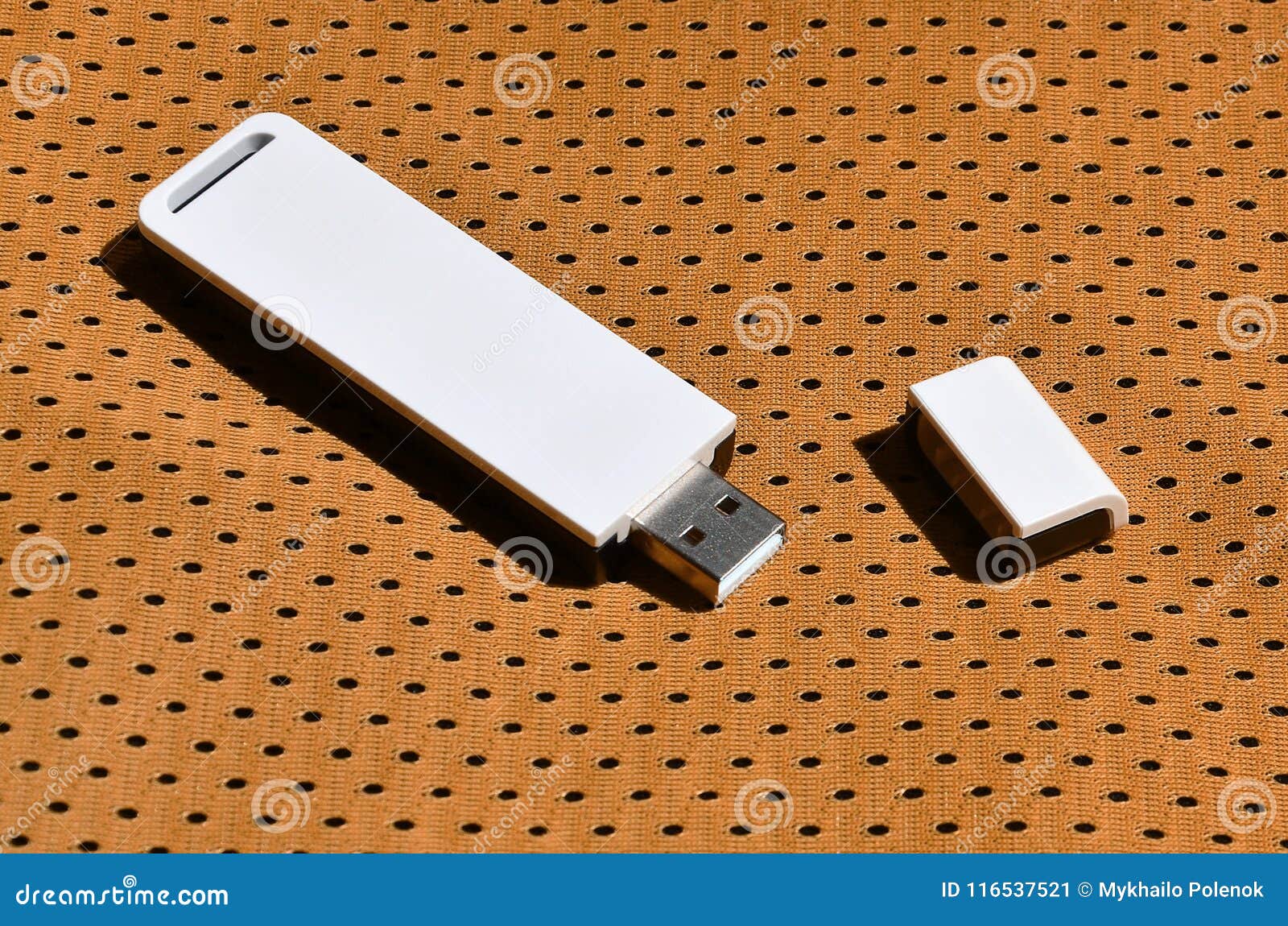 A Modern Portable Usb Wi Fi Adapter Is Placed On The Orange Sportswear