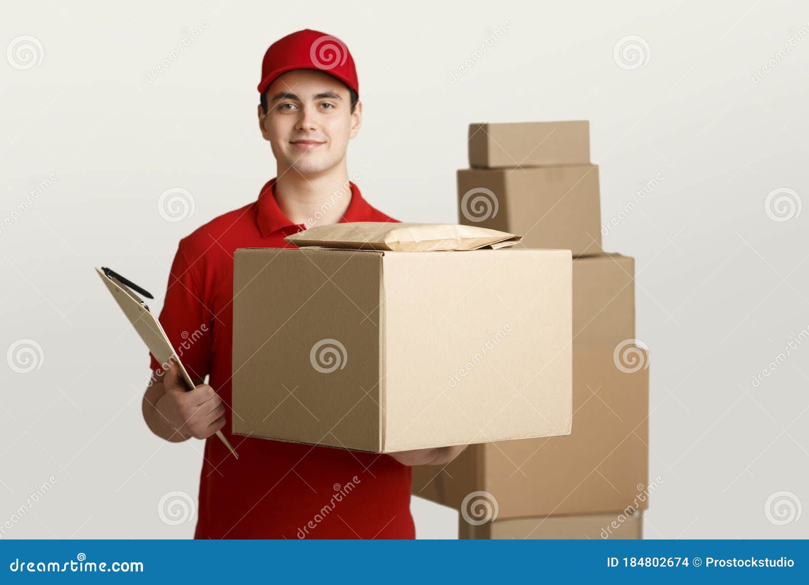 Modern Post and Online Orders. Postman Issues Large Parcel Stock Photo ...
