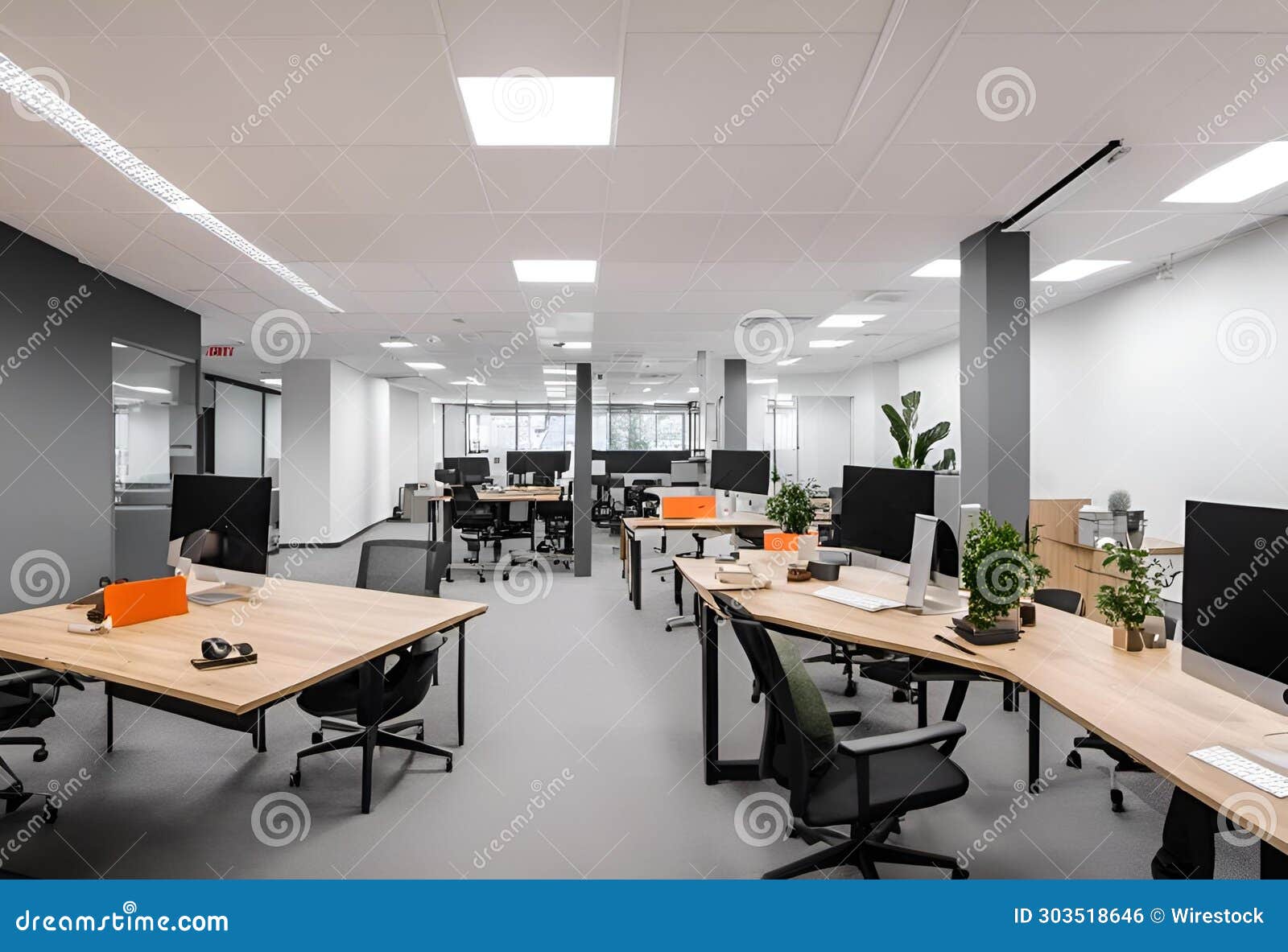 A Modern and Professional Office Space Featuring Several Desks and ...