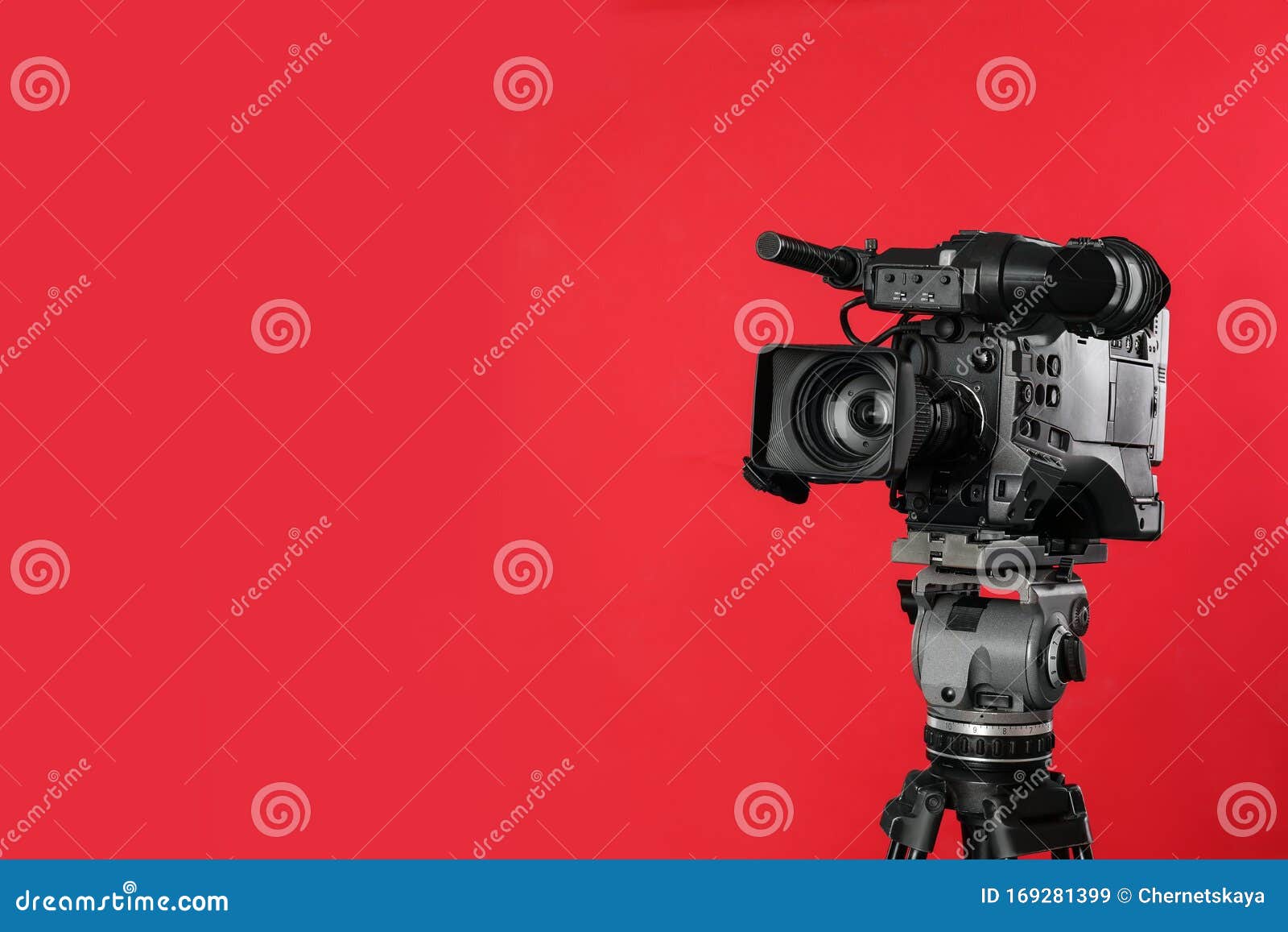 Modern Professional Video Camera on Red Background Stock Image - Image ...
