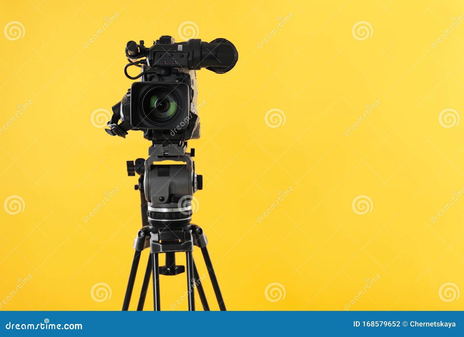 Modern Professional Video Camera on Yellow. Space for Text Stock Photo ...