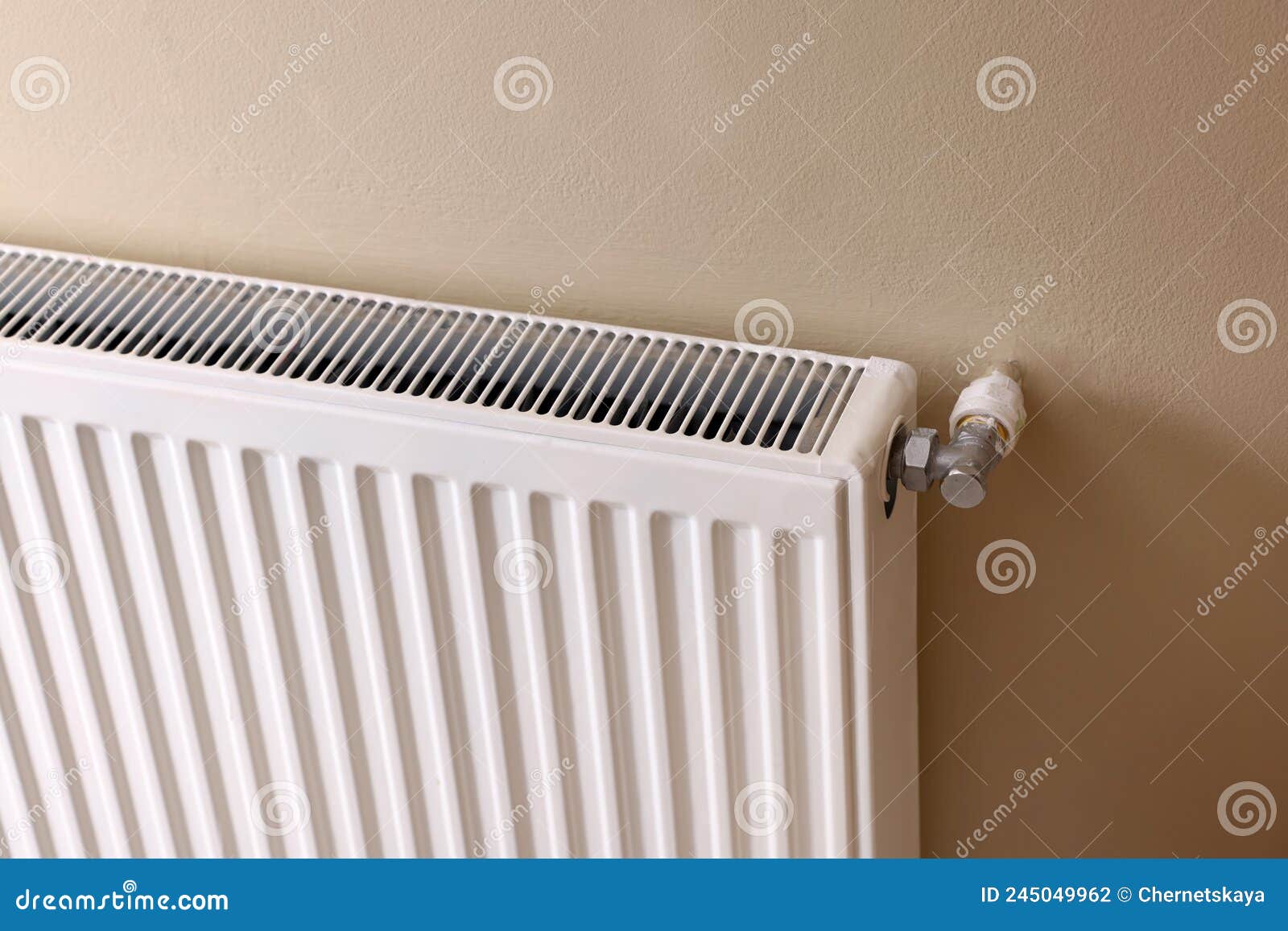 Modern Radiator on Beige Wall. Central Heating System Stock Photo ...