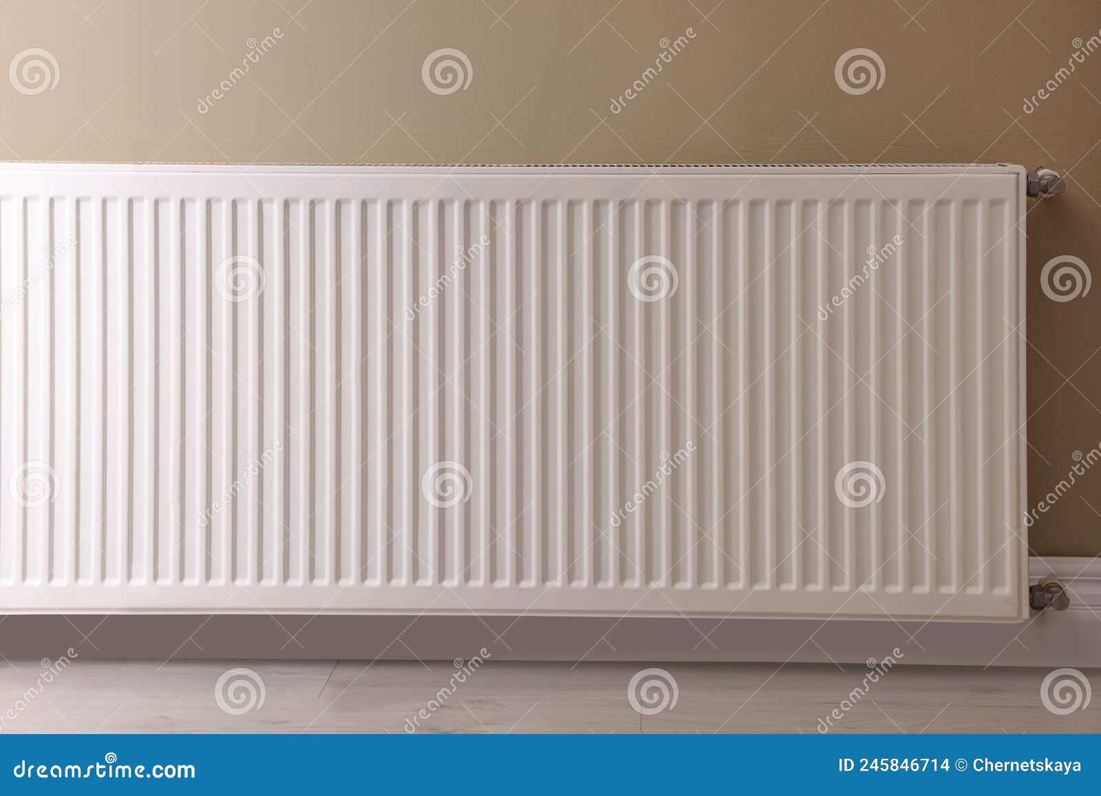 Modern Radiator on Beige Wall. Central Heating System Stock Photo ...