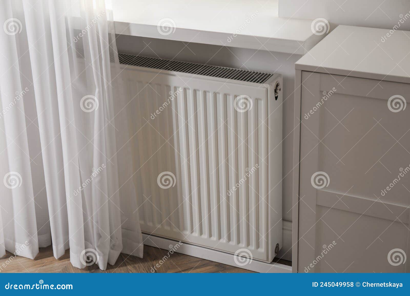 Modern Radiator on White Wall Near Window Indoors Stock Photo - Image ...