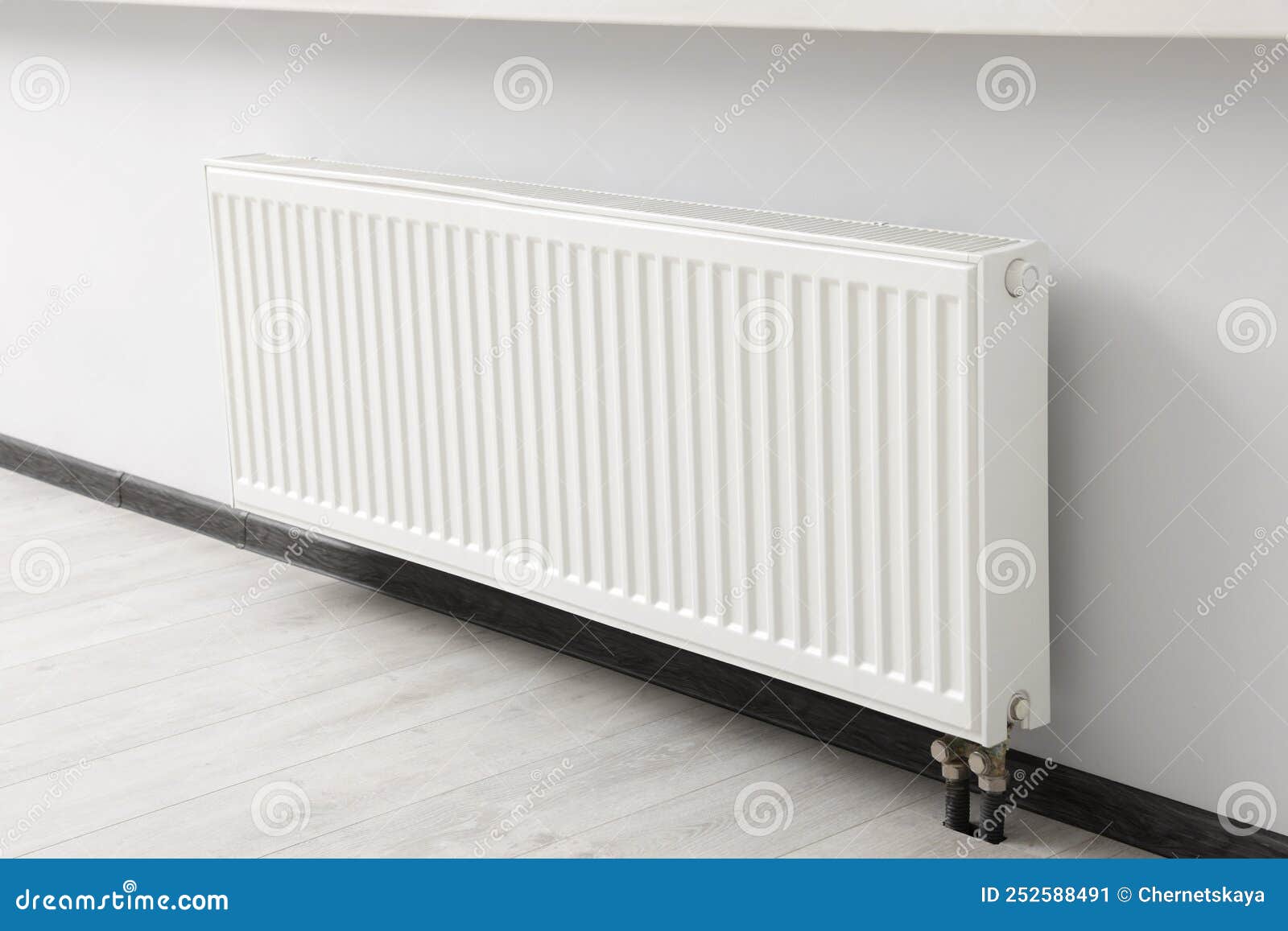 Modern Radiator on White Wall in Room. Central Heating System Stock ...