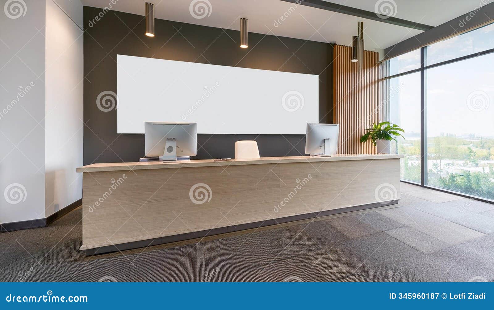 Modern Reception Area with Empty Desk, Computers, and Blank Wall Poster ...