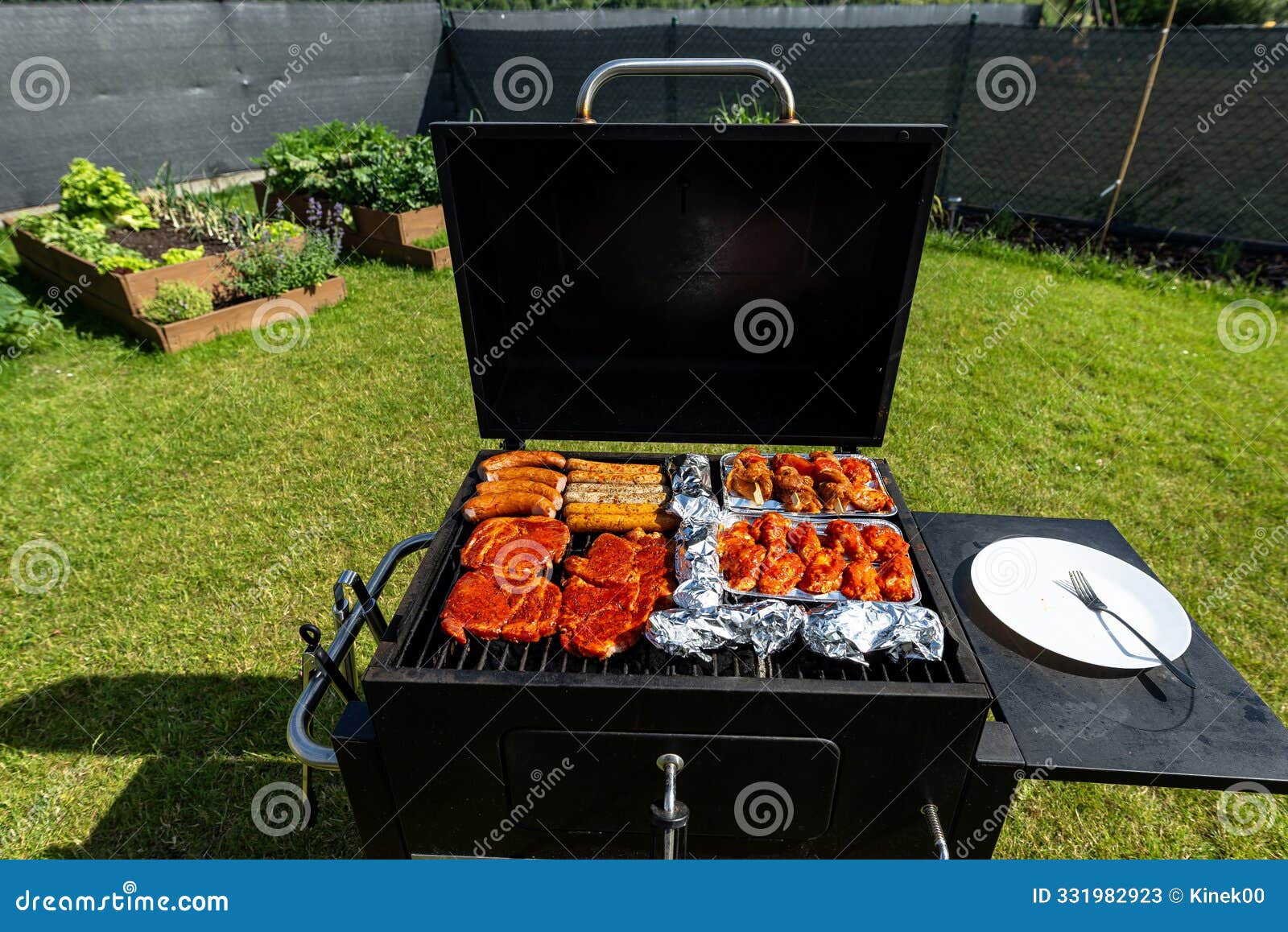 A Modern Rectangular Grill Standing in the Garden on a Beautiful Green ...