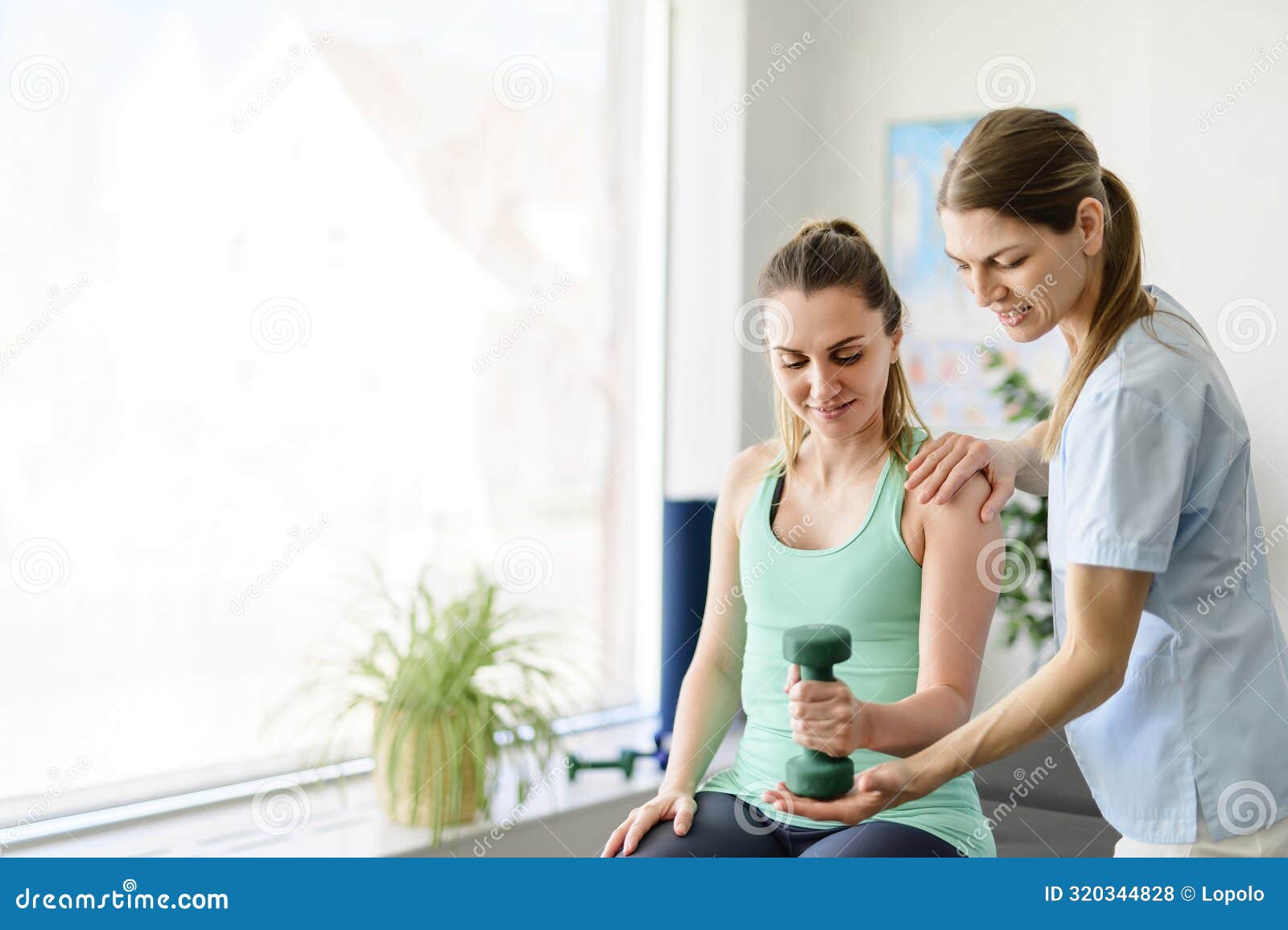 Modern Rehabilitation Physiotherapy Woman Worker with Woman Client ...