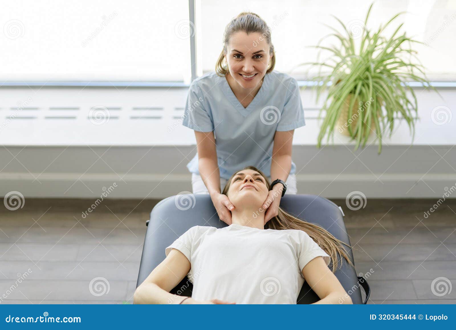 Modern Rehabilitation Physiotherapy Woman Worker with Woman Client ...