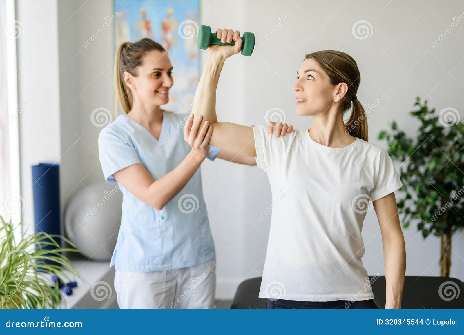 Modern Rehabilitation Physiotherapy Woman Worker with Woman Client ...