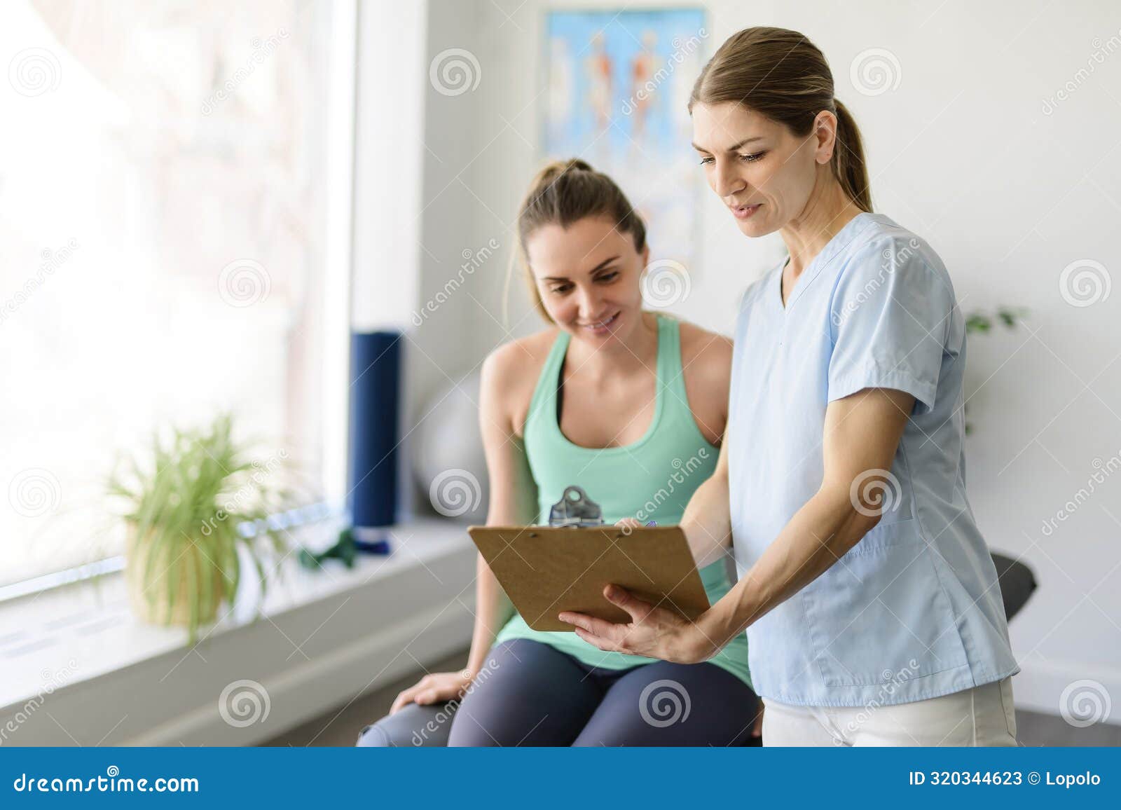 Modern Rehabilitation Physiotherapy Woman Worker with Woman Client ...