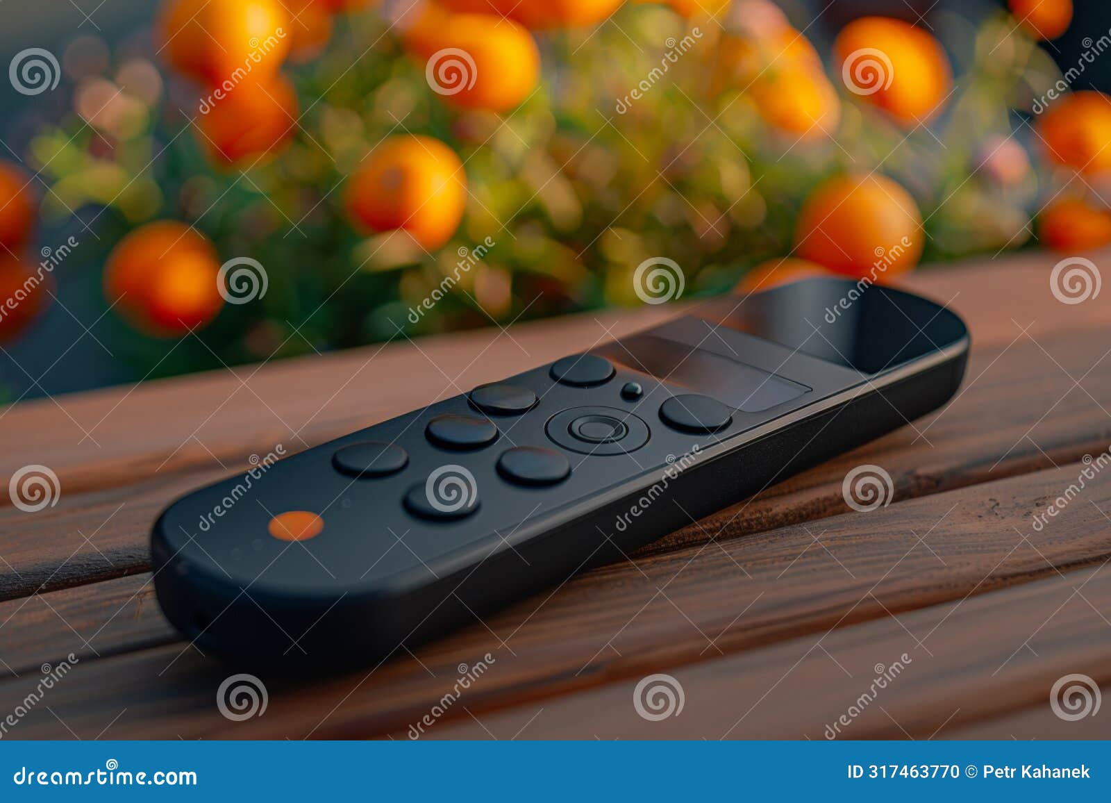 Modern Remote Control with Plastic Body and Buttons, Blurred Background ...
