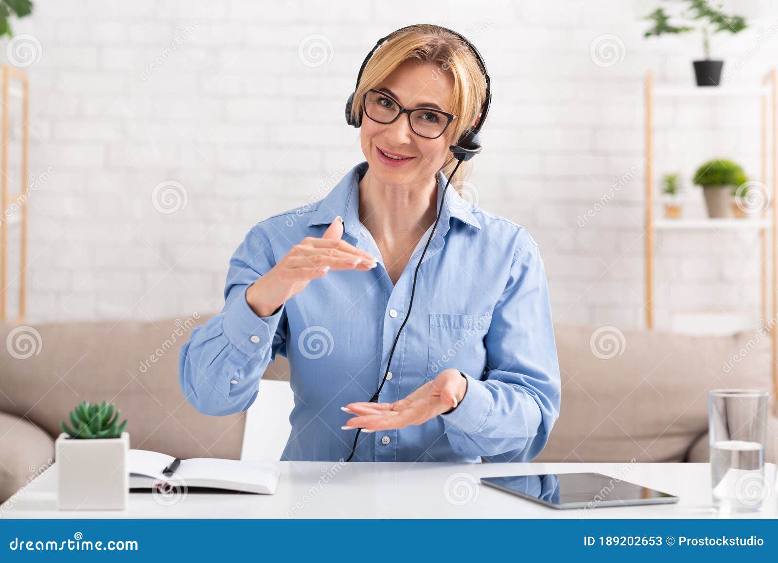 Modern Remote Work. Friendly Woman with Headset Explains To Client ...