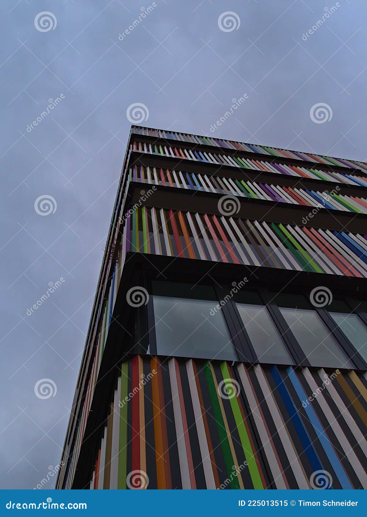 Modern Residential Building with Multi-colored Balcony Railing and ...