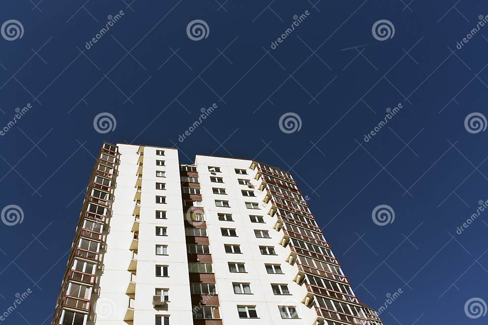 Modern Residential Building and Plane Trace in the Sky. Stock Image ...