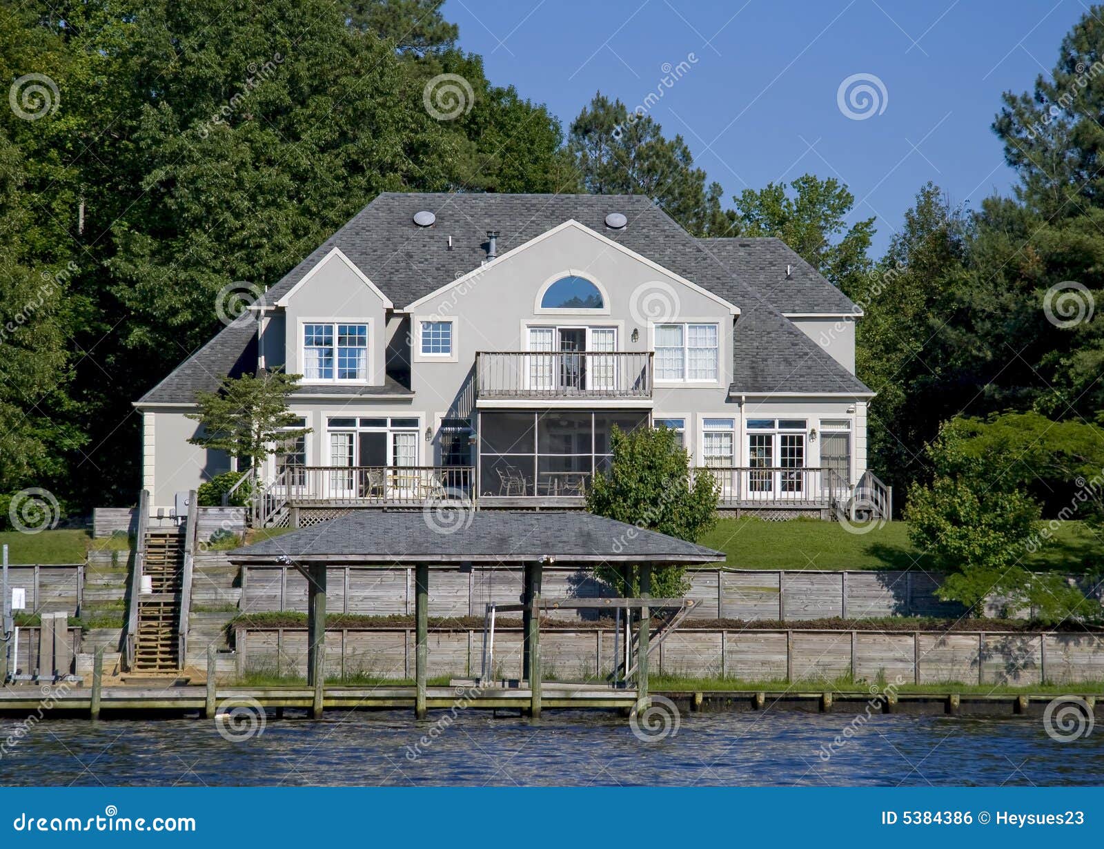 Modern river front home stock photo. Image of green, glass - 5384386