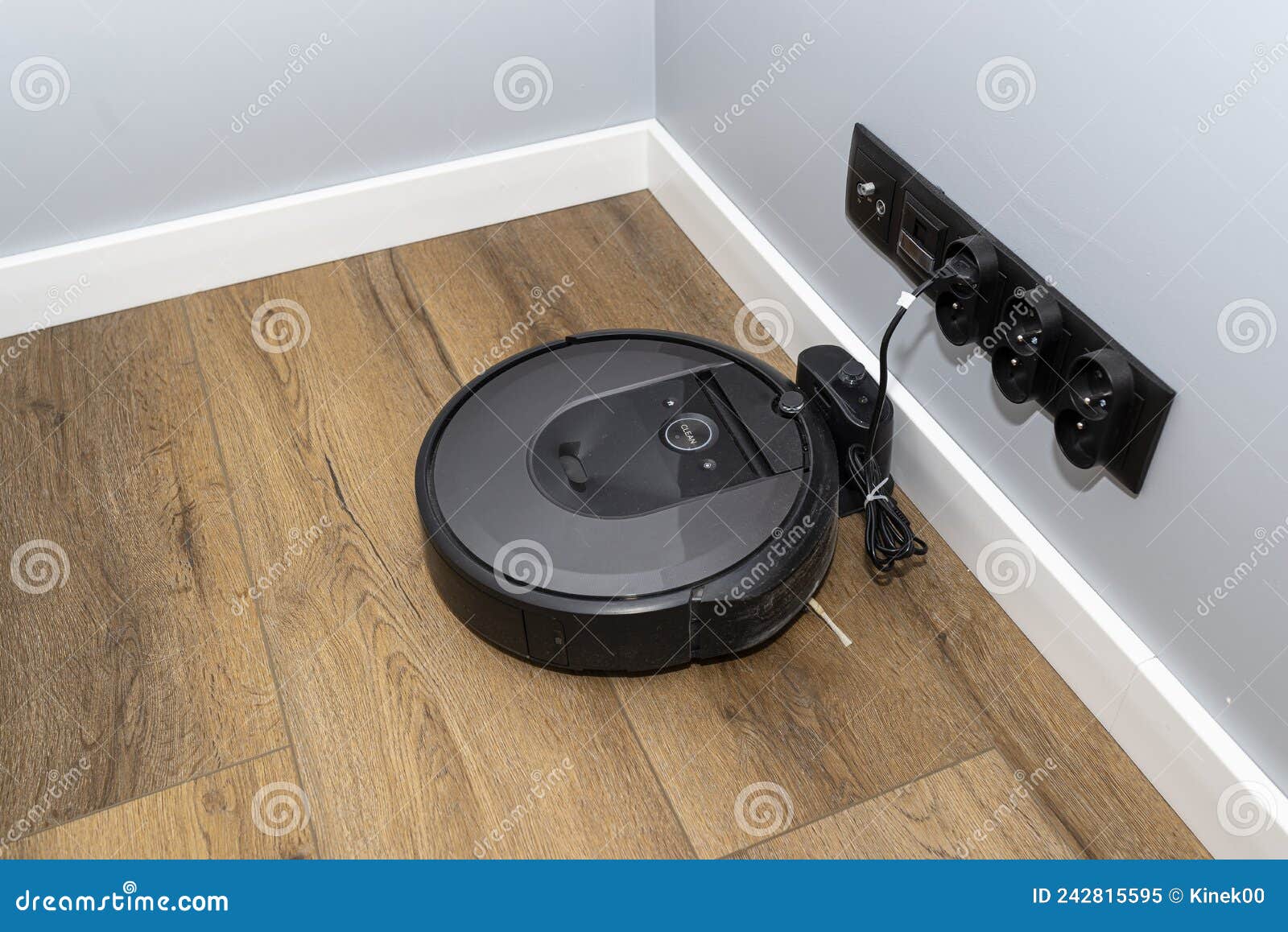 A Modern Robotic Vacuum Cleaner that Charges in a Docking Station, an ...
