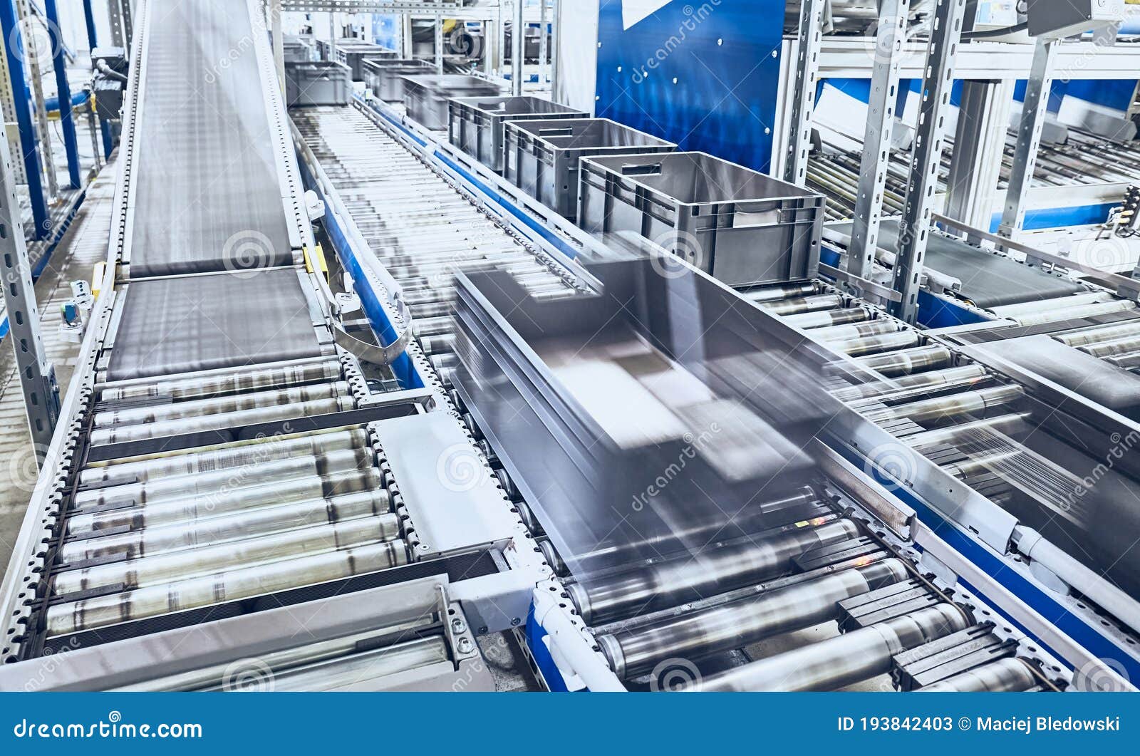 Modern Roller Conveyor System with Boxes in Motion Stock Image - Image ...