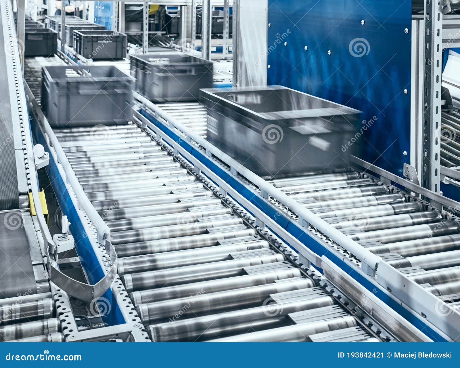 Modern Roller Conveyor System with Boxes in Motion Stock Image - Image ...