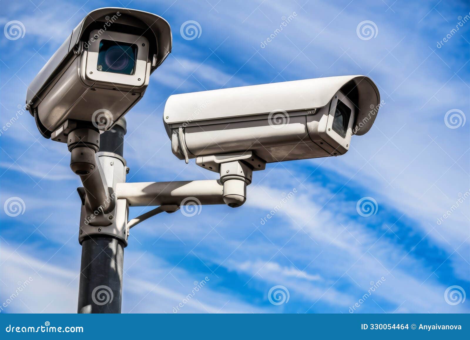 Modern Security Surveillance Cameras on Street Lamp Post with Blue Sky ...