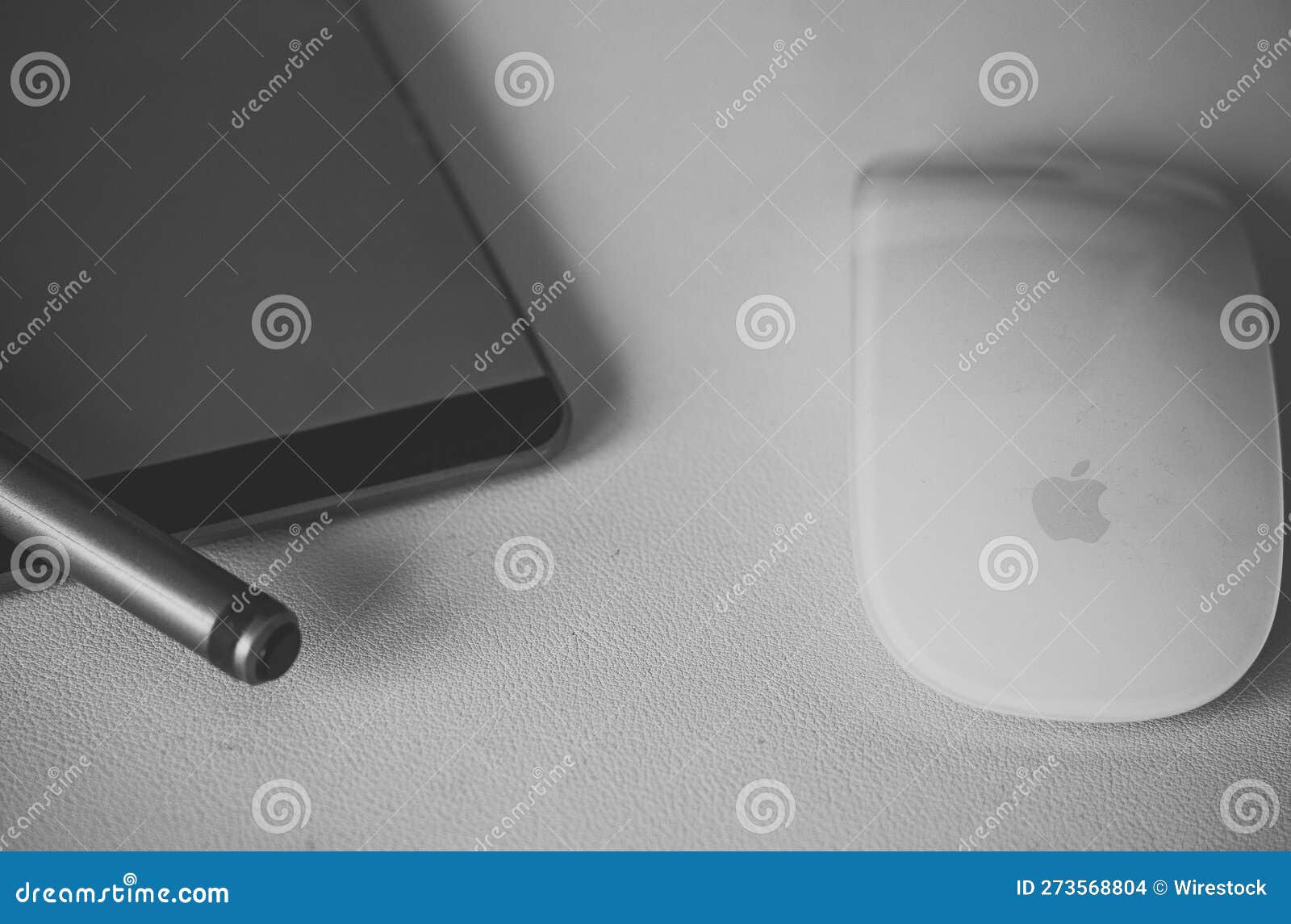 A Computer Mouse is Sitting Next To a Cellphone and Tablet Editorial ...