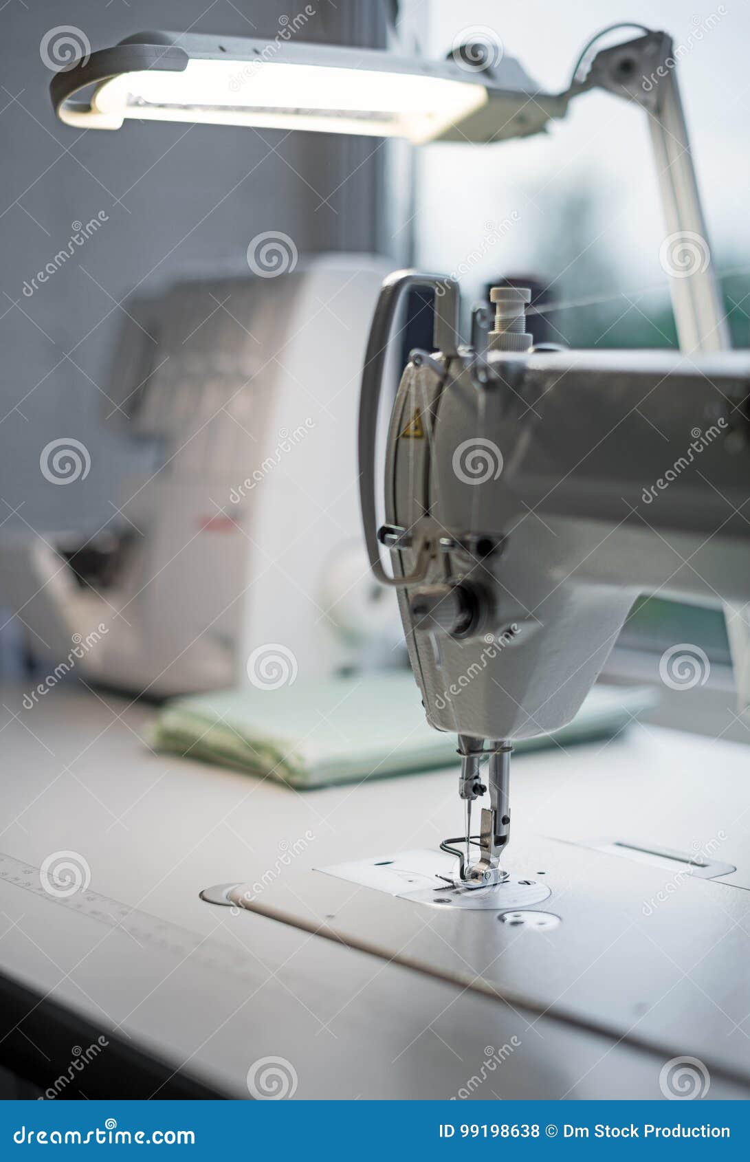 Modern sewing machine. stock photo. Image of housework - 99198638