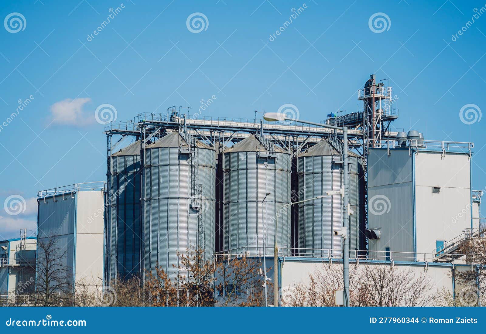 Modern Silos for Storing Grain Harvest at the Blue Sky Background ...