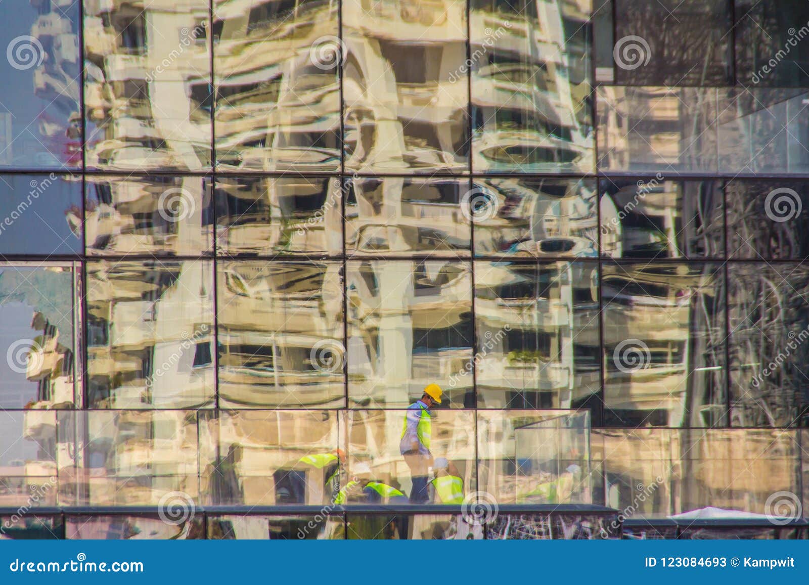 Modern Skyscraper Building with Glass Reflecting the Workers in ...