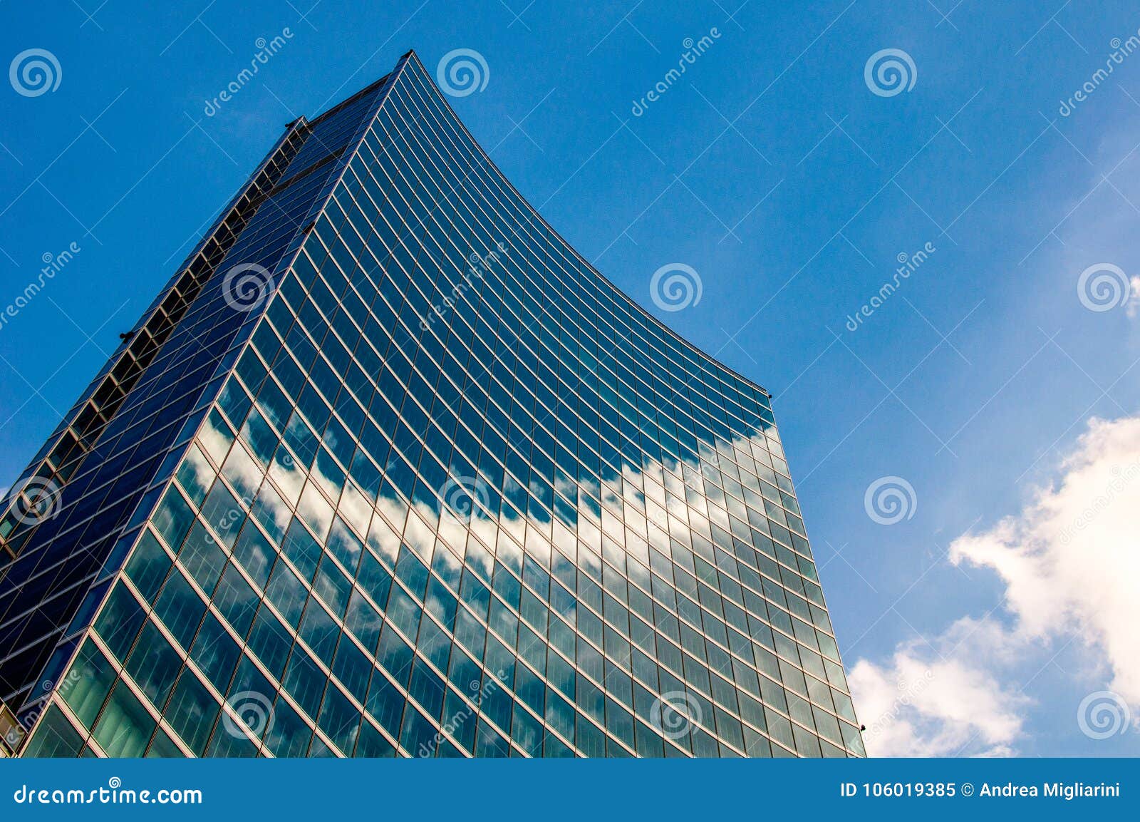 Modern Skyscraper with Reflections of Clouds on Windows Stock Image ...