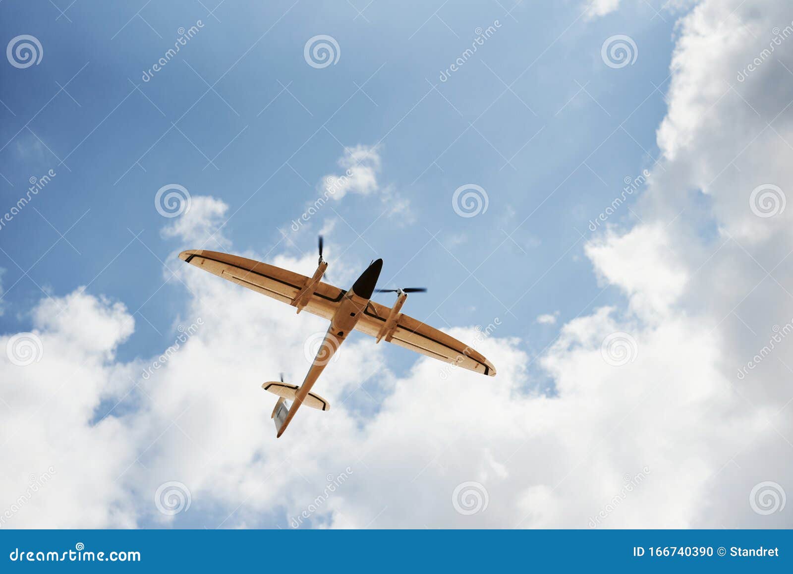 Modern Small Remote Controlled White Colored Plane Flying Up in the Sky ...