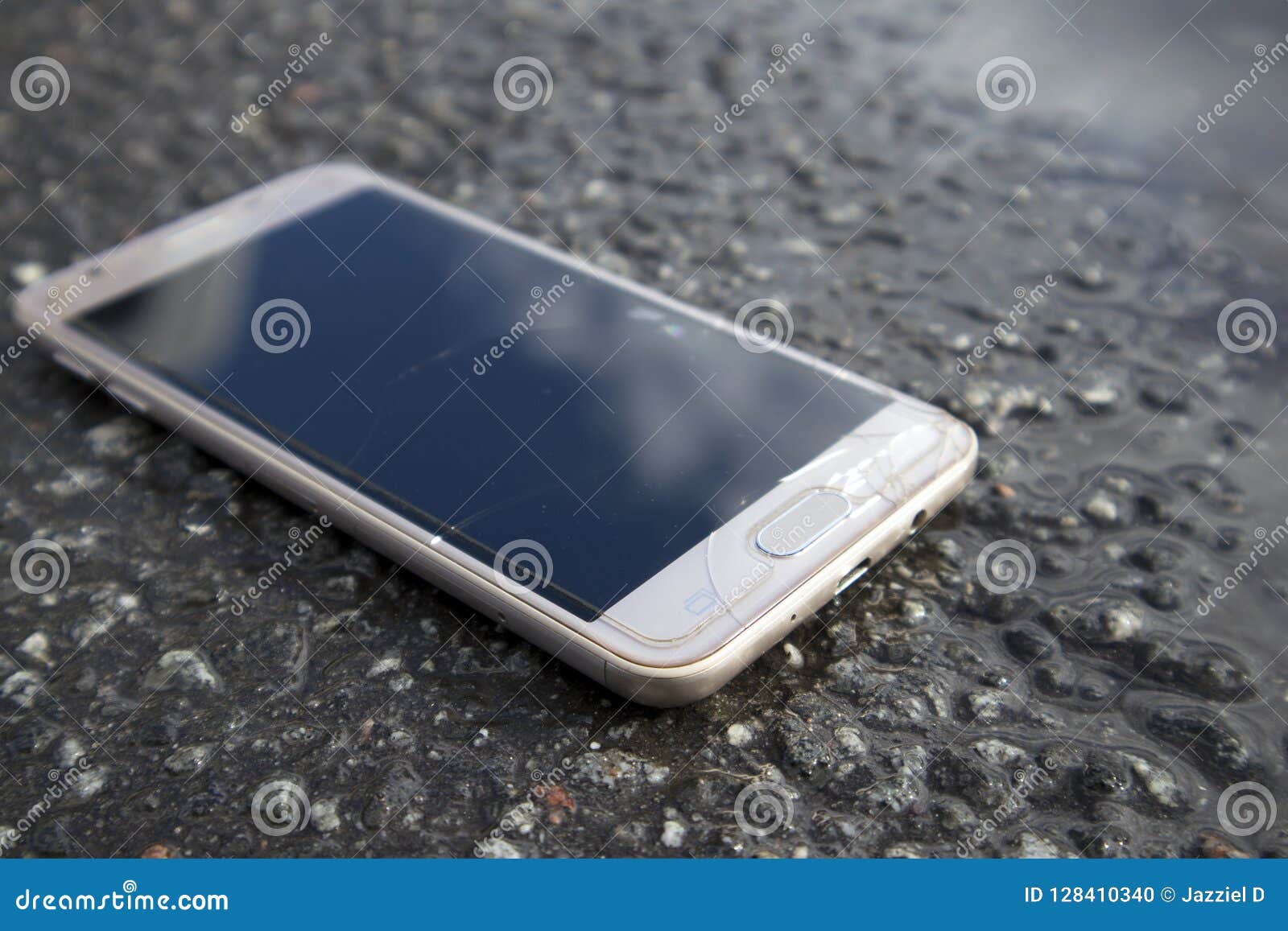Modern Smart Phone with Cracked Screen Glass Lying in a Puddle Stock ...