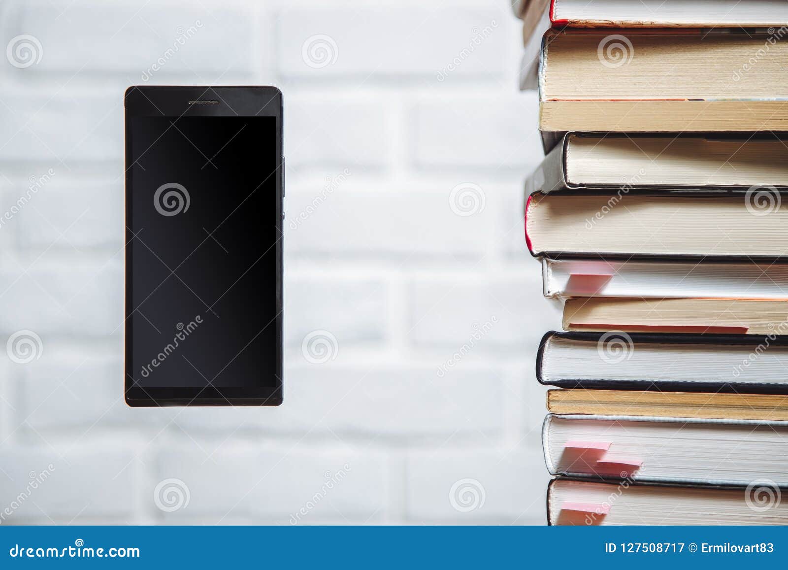 Modern Smartphone with Blank Screen and Stack of Books. Technology Vs ...
