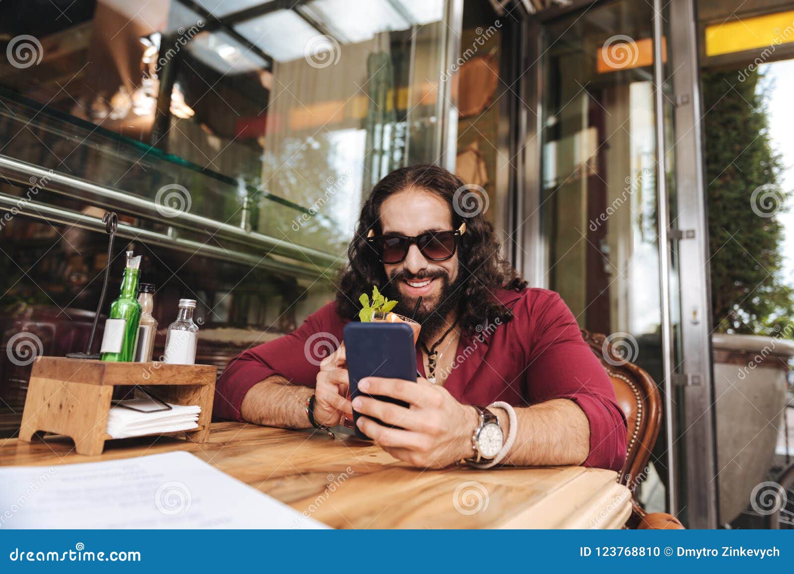 Cheerful Positive Man Using His Gadget Stock Photo - Image of ...