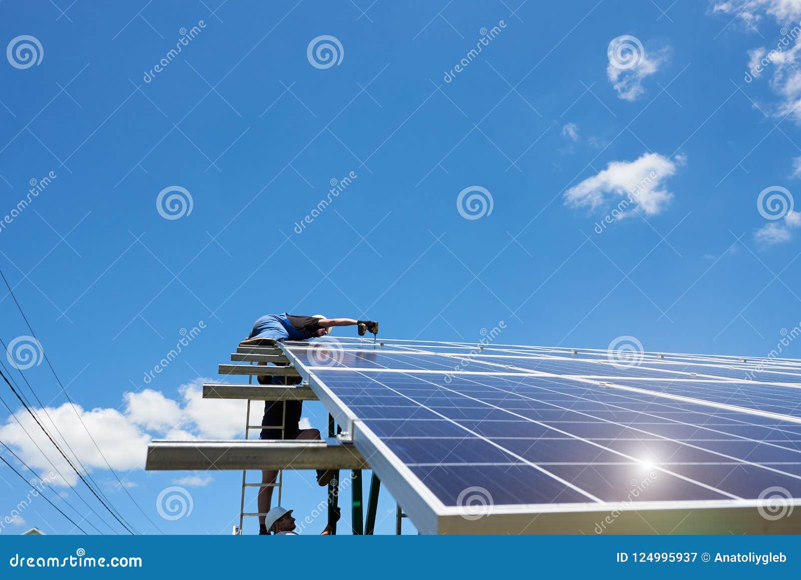 Modern Solar Batteries Installed on Blue Sky Background. Stock Image ...