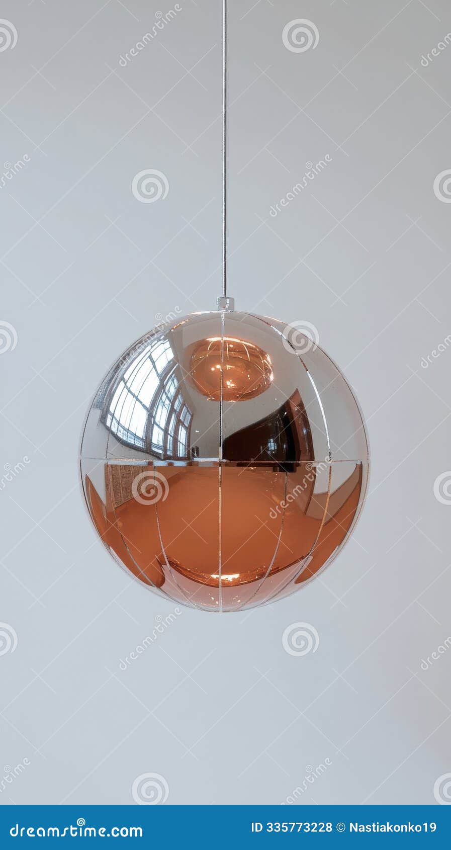 Modern Spherical Pendant Lamp with Reflective Surface Stock Photo ...