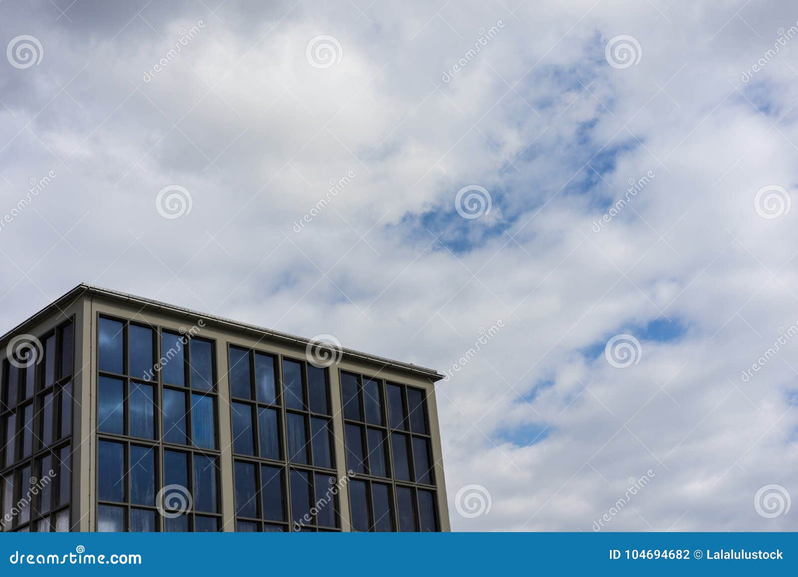 Modern Square Building with Cloudy Sky Stock Photo - Image of finance ...