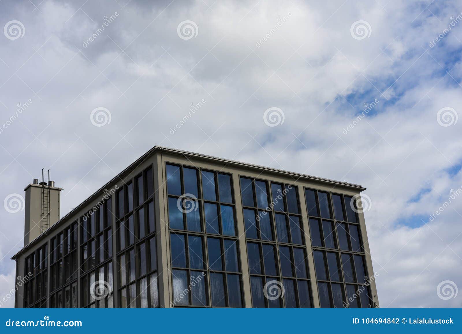 Modern Square Building with Cloudy Sky Stock Photo - Image of facade ...