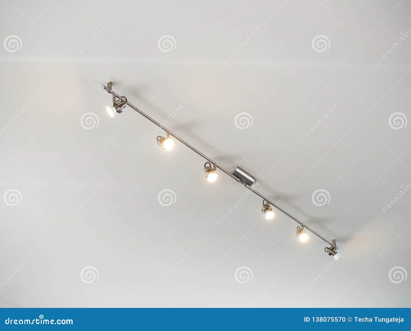 Modern Stainless Steel Track Light Hanging on White Ceiling Stock Photo ...