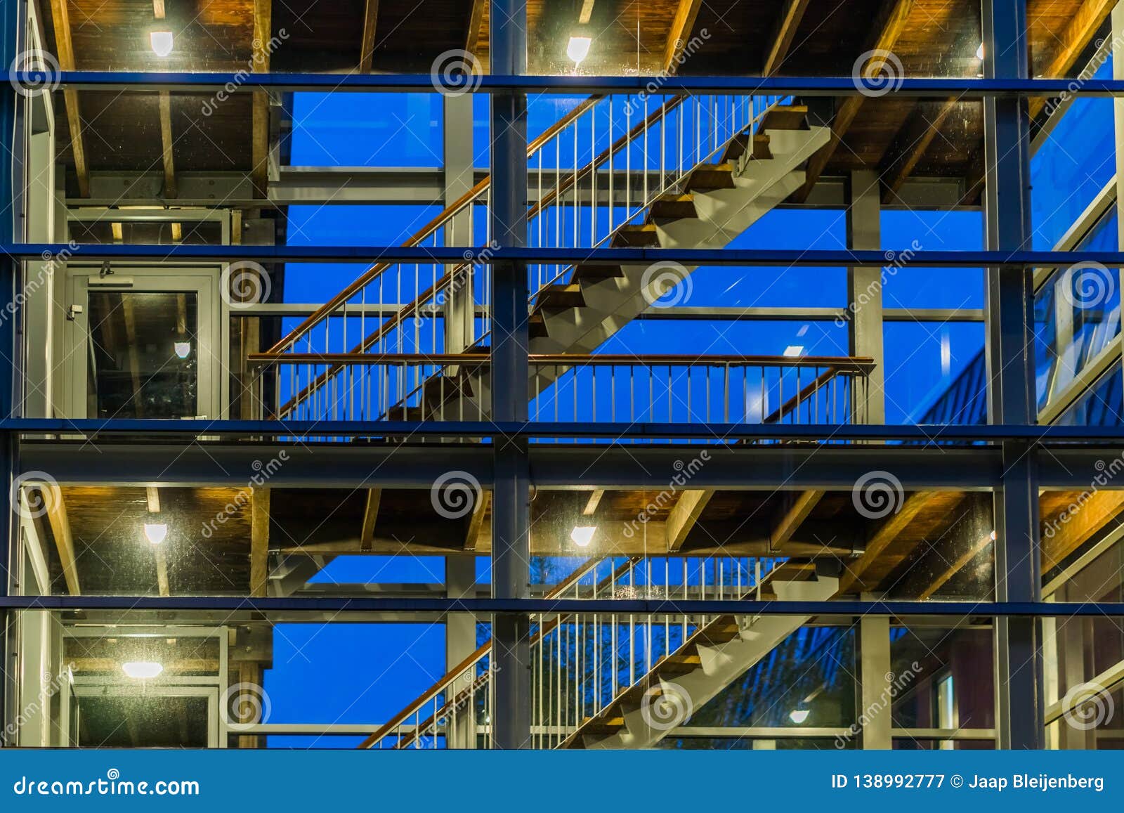 Modern Staircase Building with Glass Windows, Lighted at Night ...