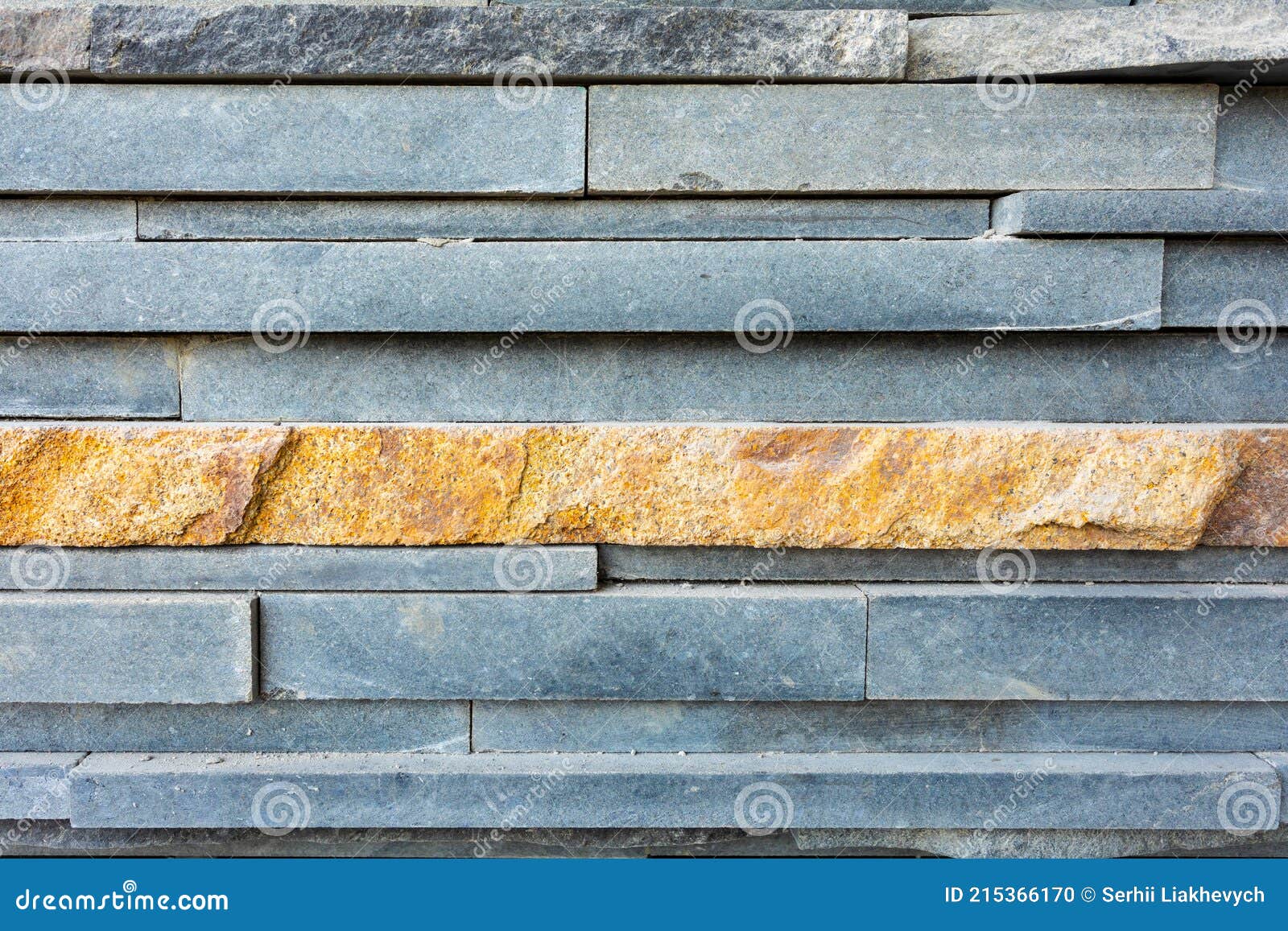 A Modern Stone Wall Made of Long Large Cuts of Stones. Stock Photo ...