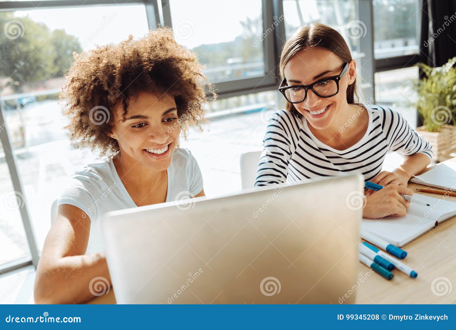Close Up of Cheerful Students Using Laptop for Studying Stock Photo ...
