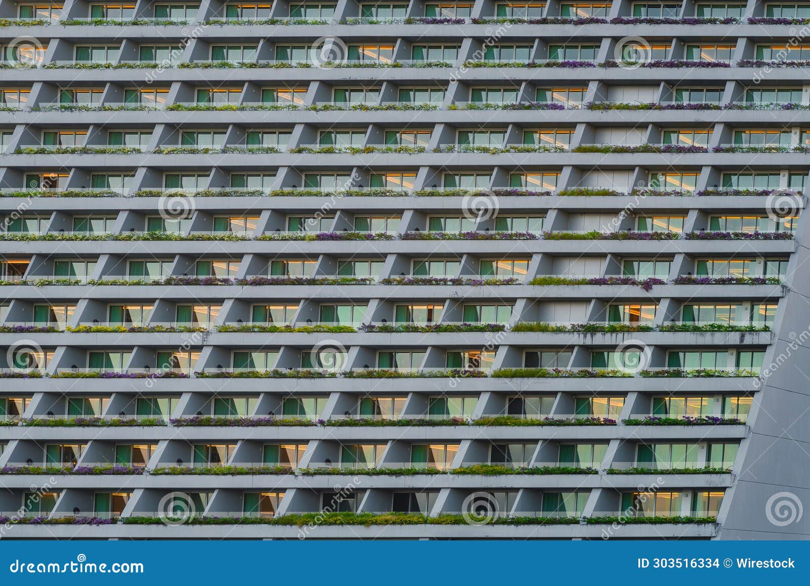 Modern-style Building with Multiple Windows and Grassy Balconies in ...