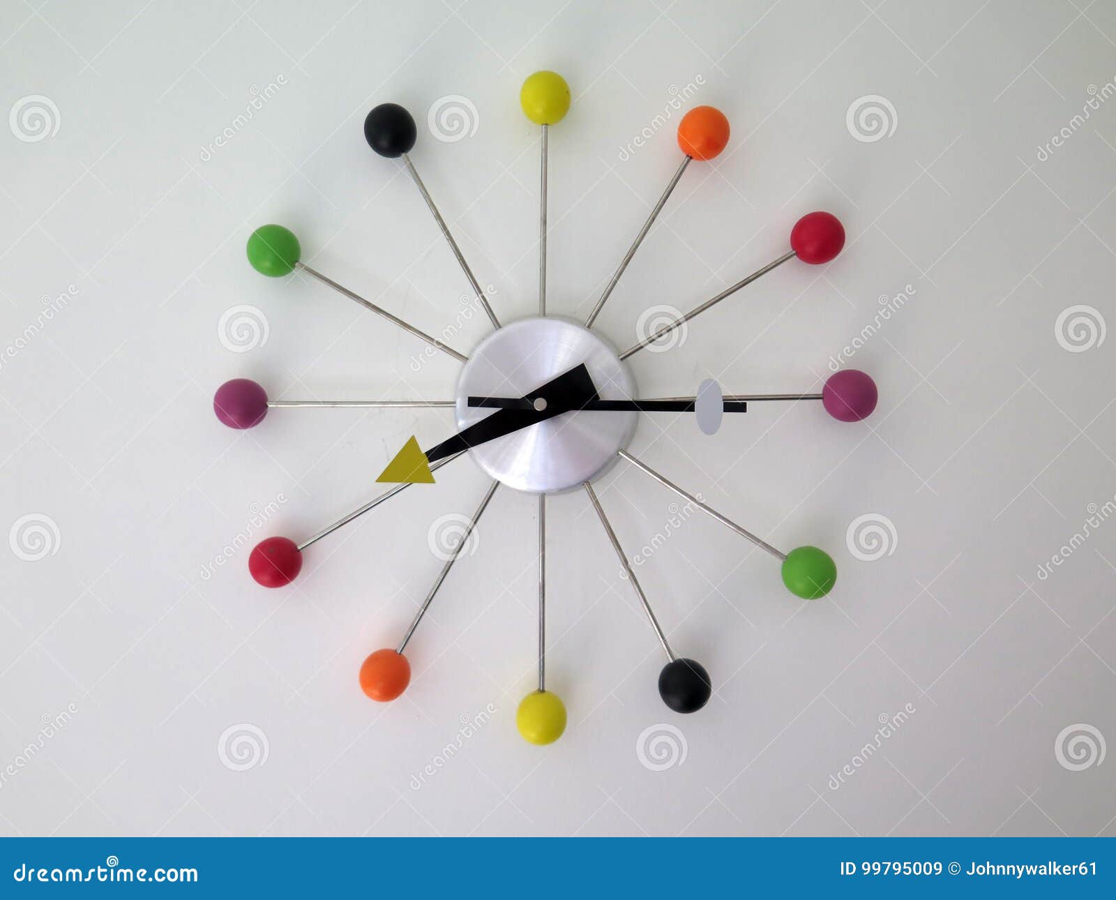 Modern Wall clock stock image. Image of modern, balls - 99795009