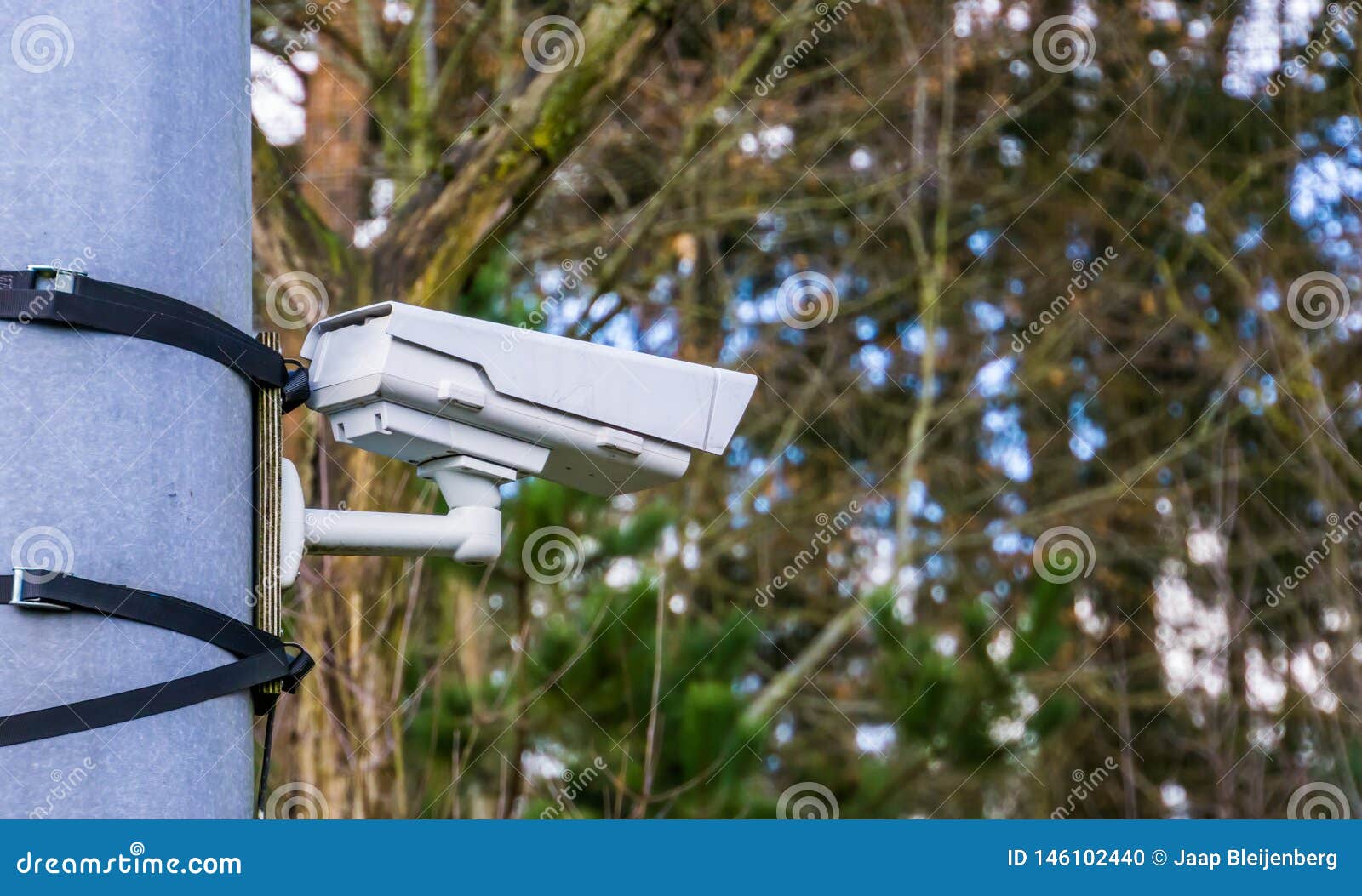 Modern Surveillance Cameras In The Park With Tall Building Background ...