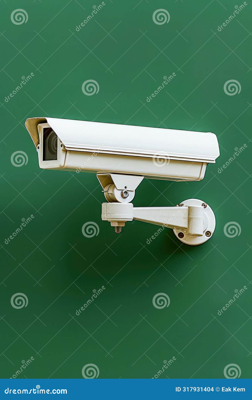 Modern Surveillance Camera Mounted on Wall Against Green Background for ...