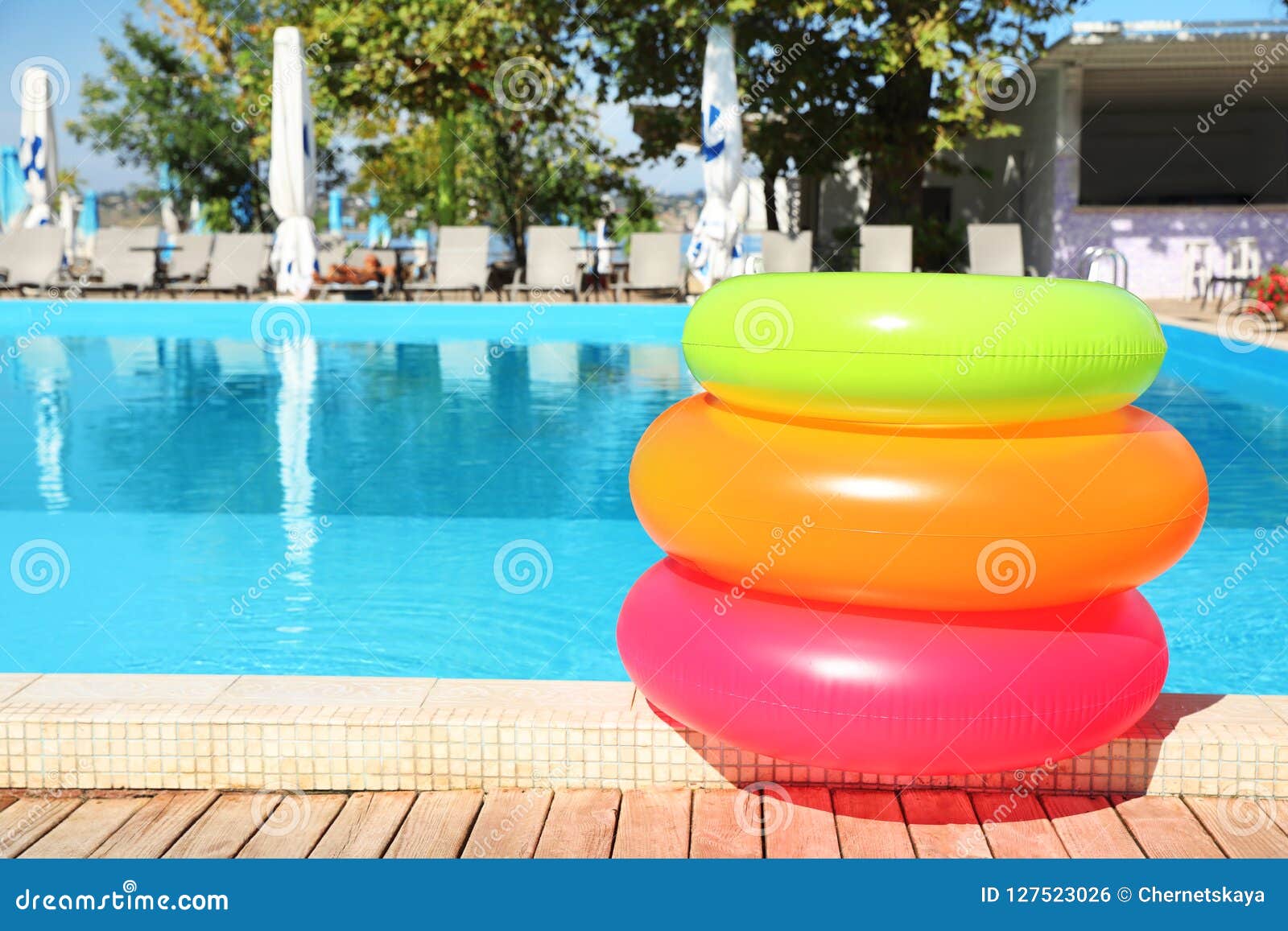 Modern Swimming Pool with Inflatable Rings Outdoors Stock Photo - Image ...