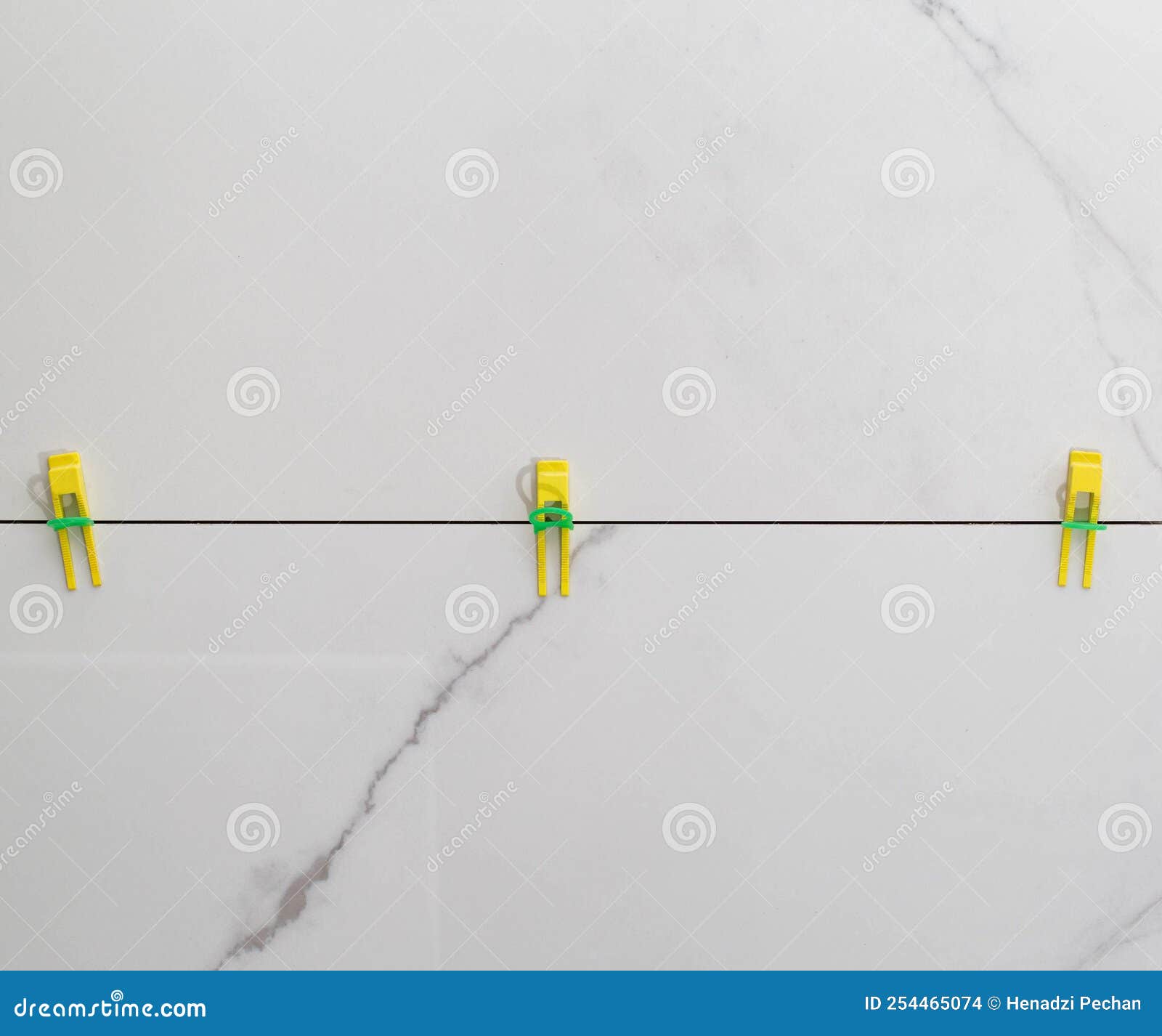 Modern System for Leveling Tiles during Installation. Installation of ...