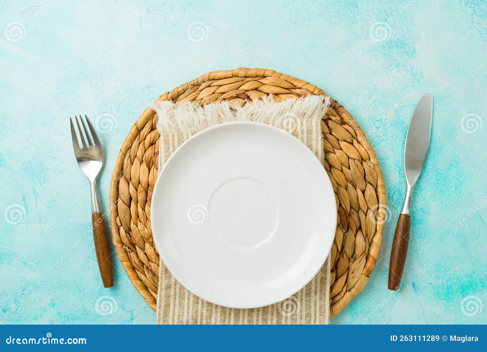 Modern Table Setting With Plate Wicker Place Mat And Tablecloth Top